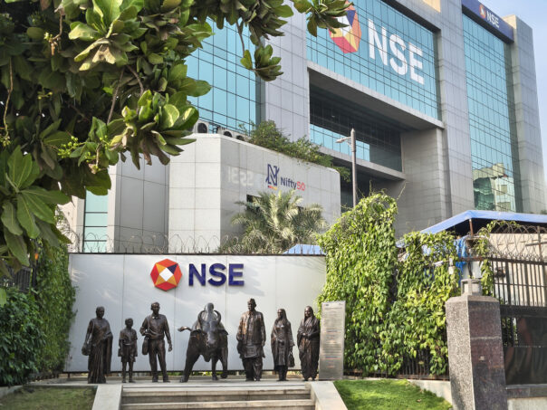 NSE building with glass facade, financial sculptures and market symbols ...